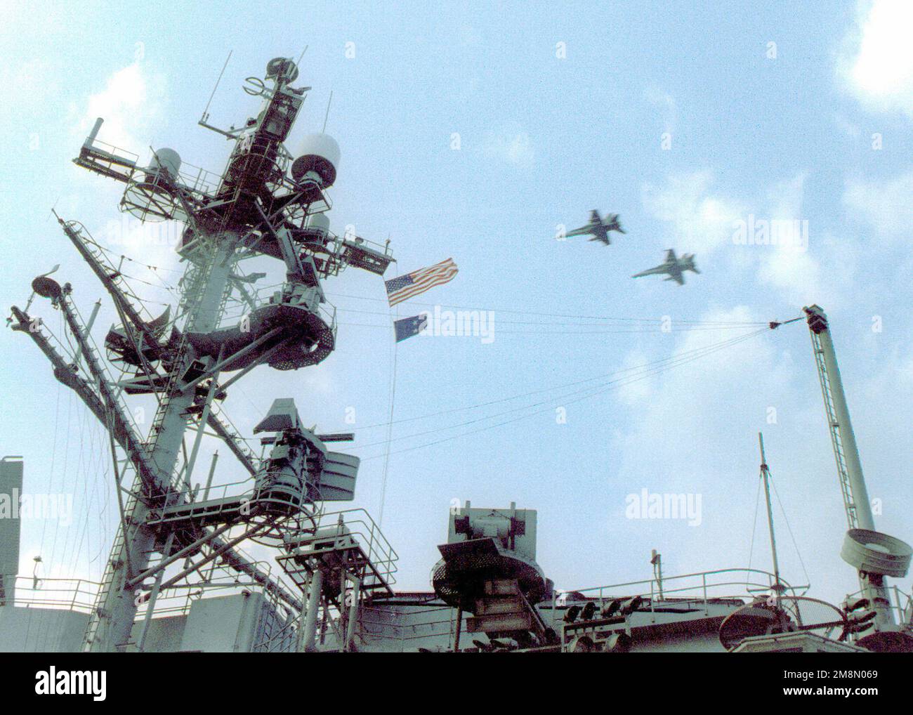 Two F/A-18 Hornet strike fighters make a low level pass over the ...