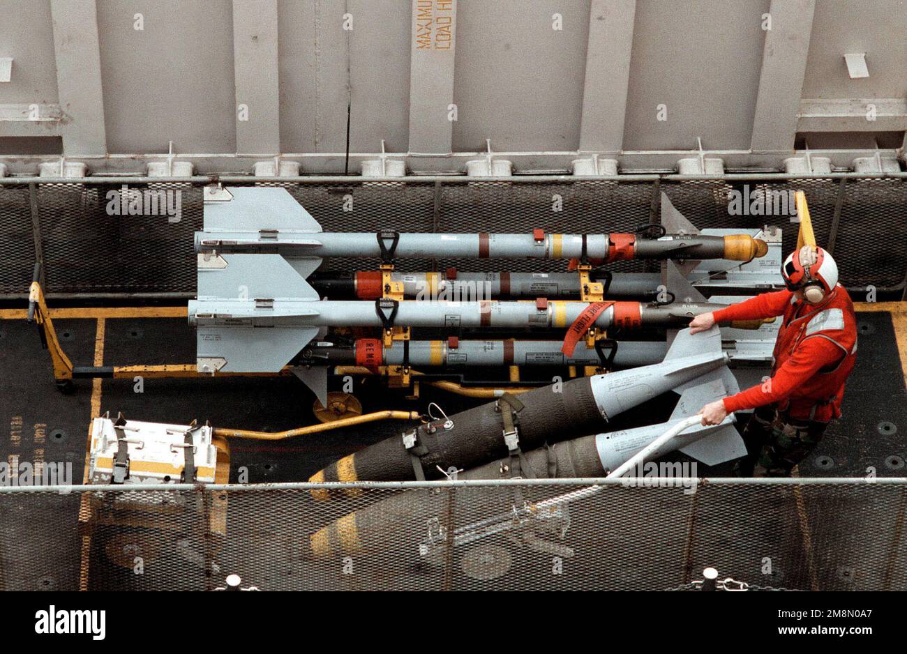 Aviation Ordnanceman First Class Jeffery Serrano transports MK-83 1000 ...