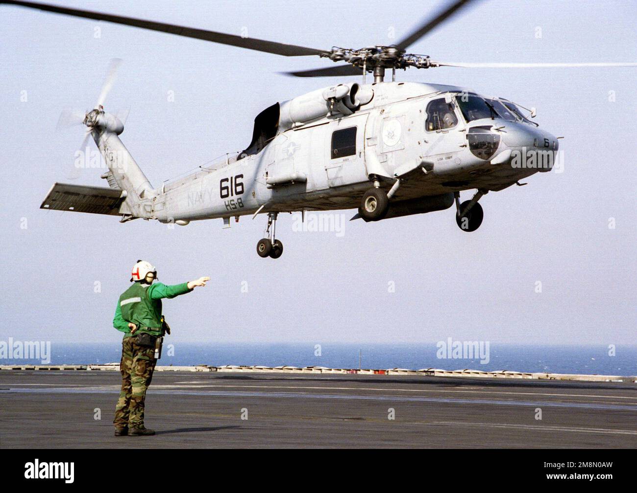 Aviation Machinists Mate, AIRMAN Recruit Jeremy Barkley directs an SH ...