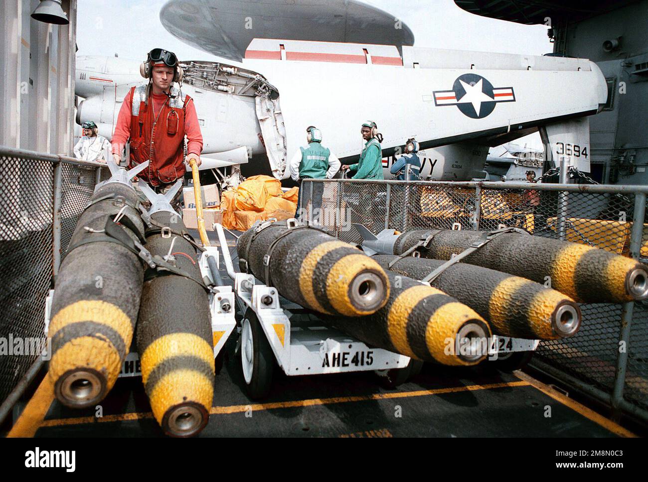 Aviation Ordnanceman 3rd Class William Bailey, Jr. transports MK-82 500 ...