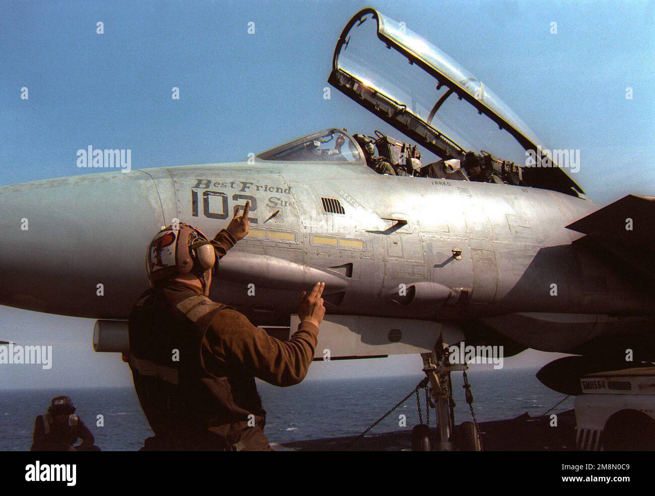 AMN Justin Horn (left) signals LT Ron Gorman (center) and LT. Jim Bates ...