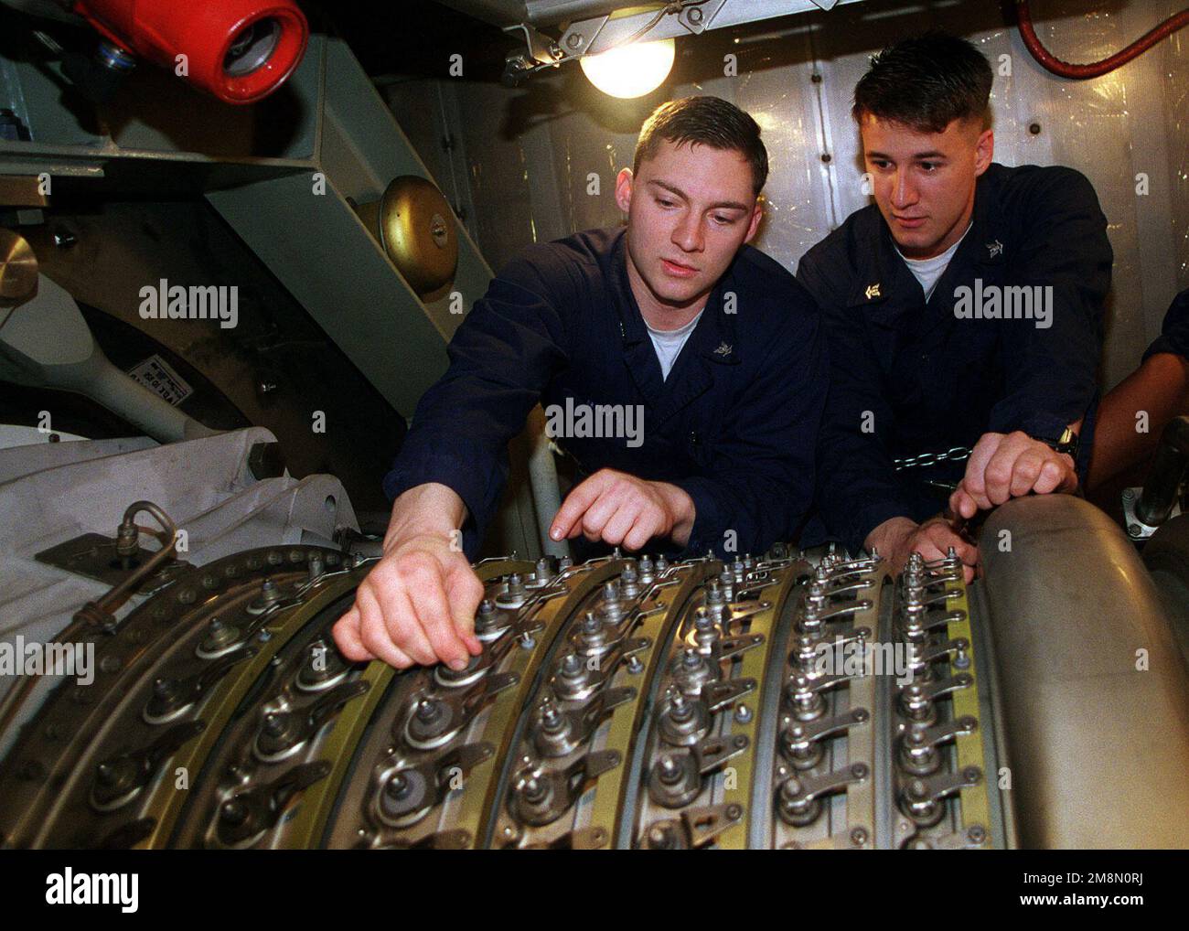 Gas Systems Technician 3rd Class Jason Bruce (left) conducts ...
