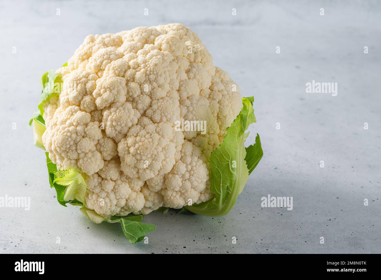 Cauliflower close-up on light grey stone background, copy space Stock ...