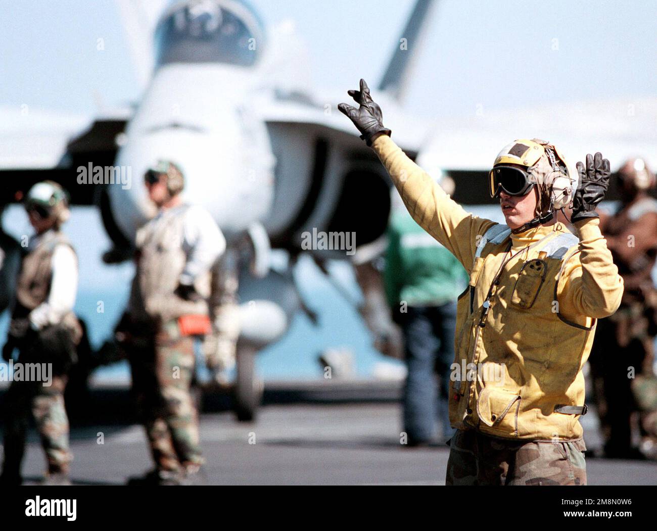 US Navy Aviation Boatswains Mate AIRMAN (ABAN) Terry Hudnett directs an ...