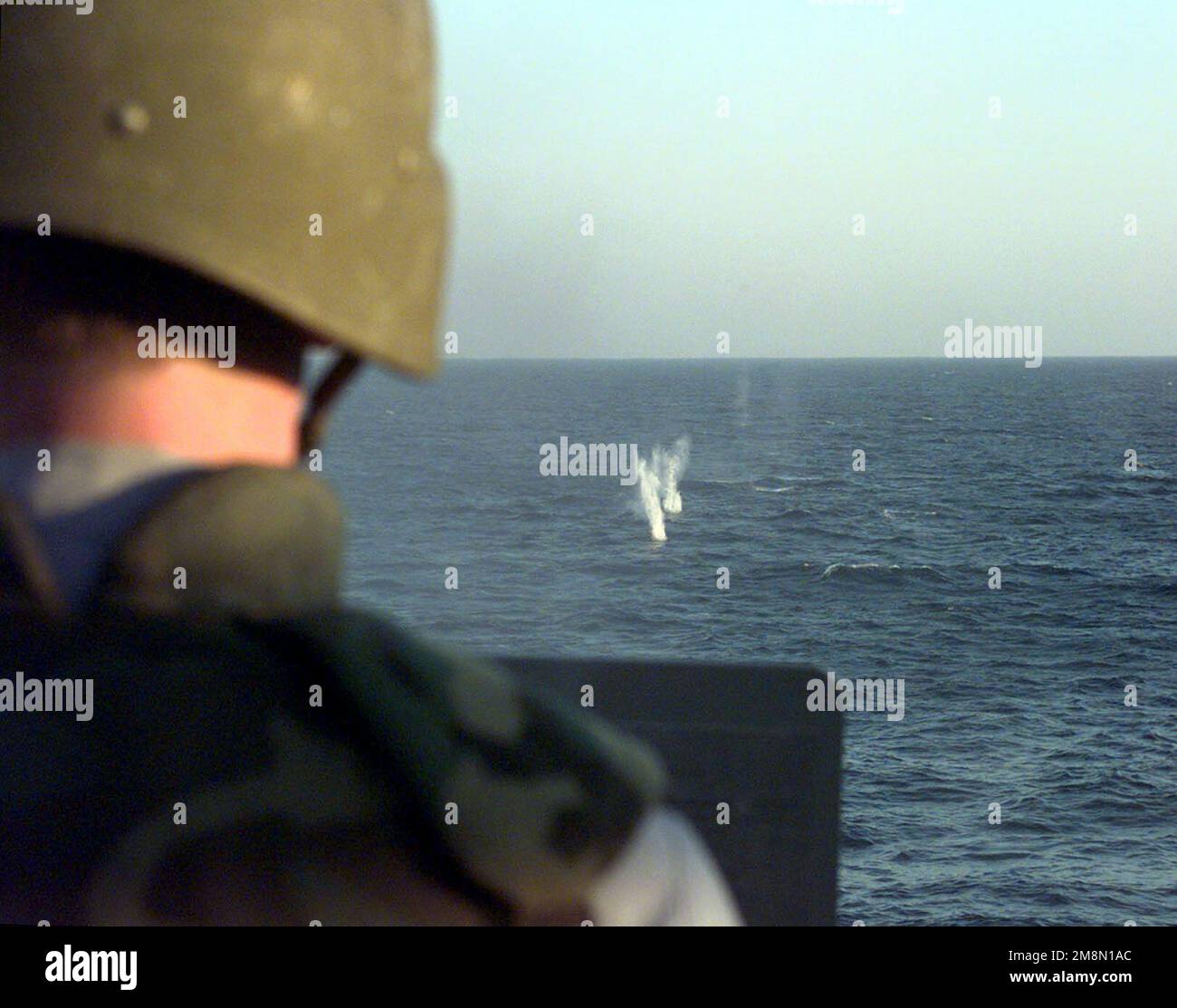 US Navy Fire Control Technician 3rd Class Mendleson fires a M-2 .50 ...