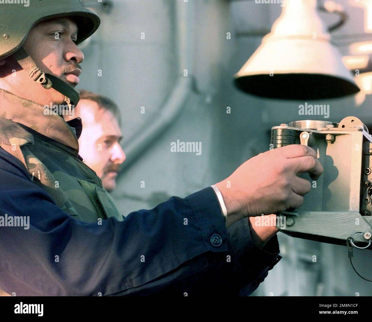 US Navy Sonar Technician 3rd Class Corwyn Smith fires a M-2 .50 caliber ...