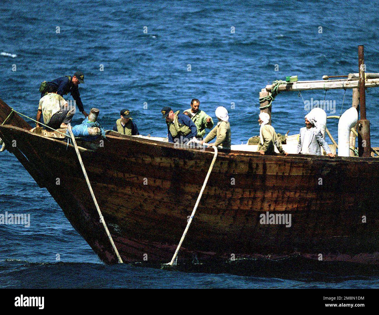 Sailors from USS SAMUEL B. ROBERTS (FFG-58) and the crew of an Iranian ...