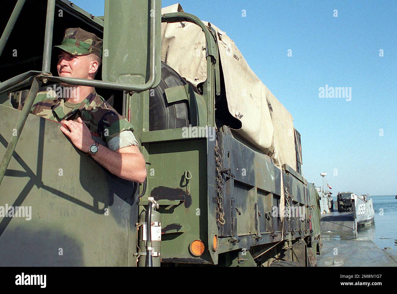 US Marine Lance Corporal Jamie Hendricks backs up a Marine Corps truck ...