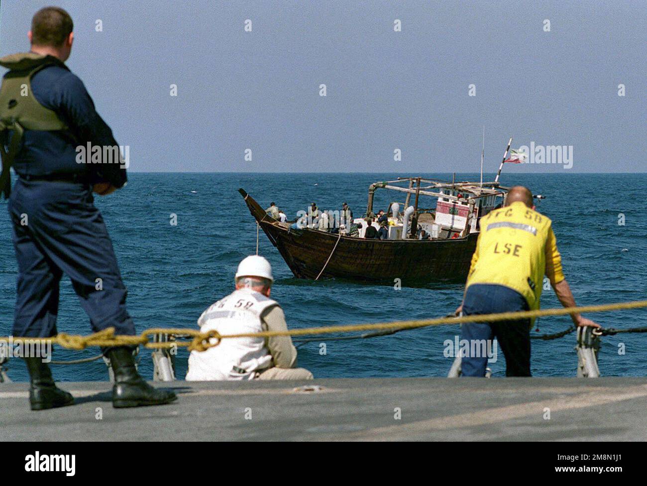 Sailors watch from the fantail of USS SAMUEL B. ROBERTS (FFG-58) as ...