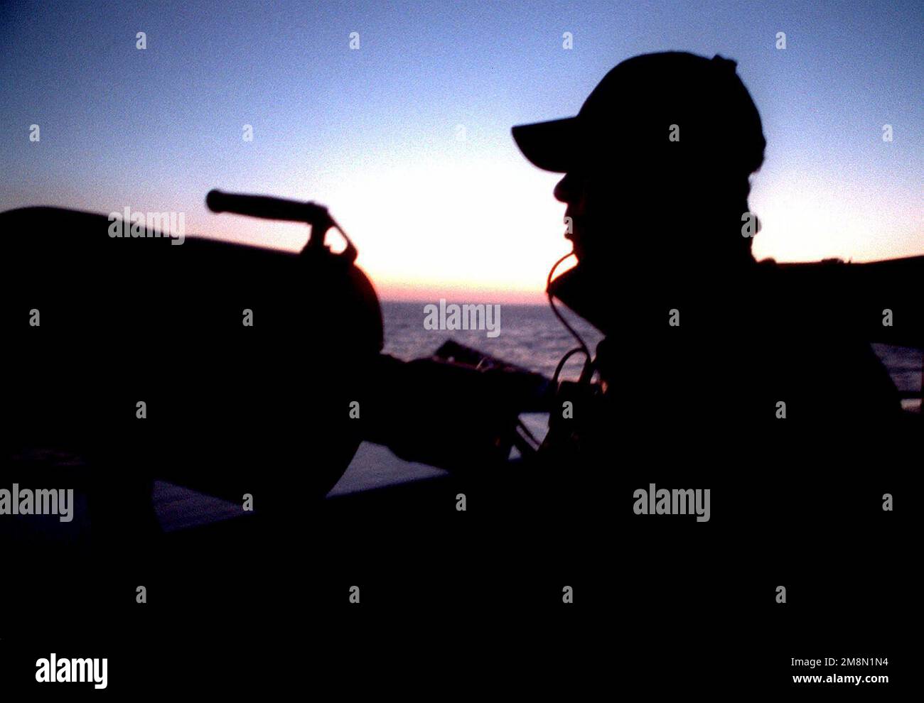 US Navy SEAMAN Jose Ortiz stands the port lookout aboard Oliver Hazard ...
