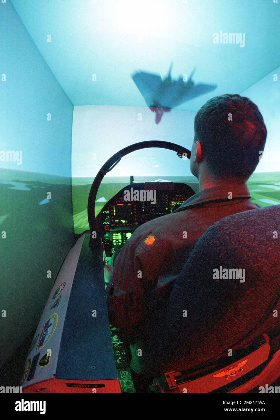 US Navy Lieutenant Commander Bryan Kust sits in a F/A 18 Hornet flight ...