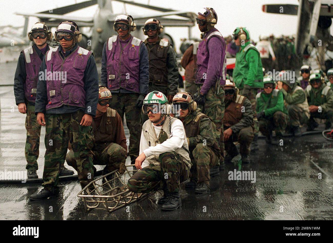 US Navy Sailors prepare to rescue simulated casualties during a mass ...