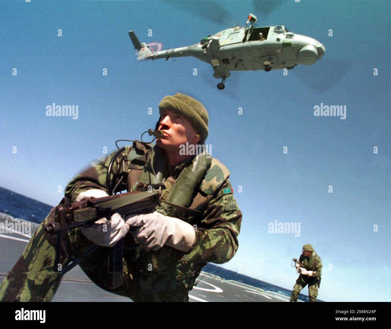 A Portuguese Marine squad drops back aboard the Vasco de Gama Class ...
