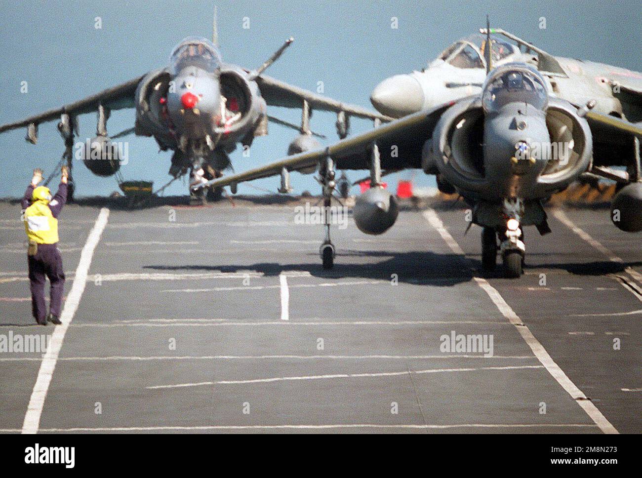 Crewmen aboard the Invincible Class Aircraft Carrier, HMS ILLUSTRIOUS ...