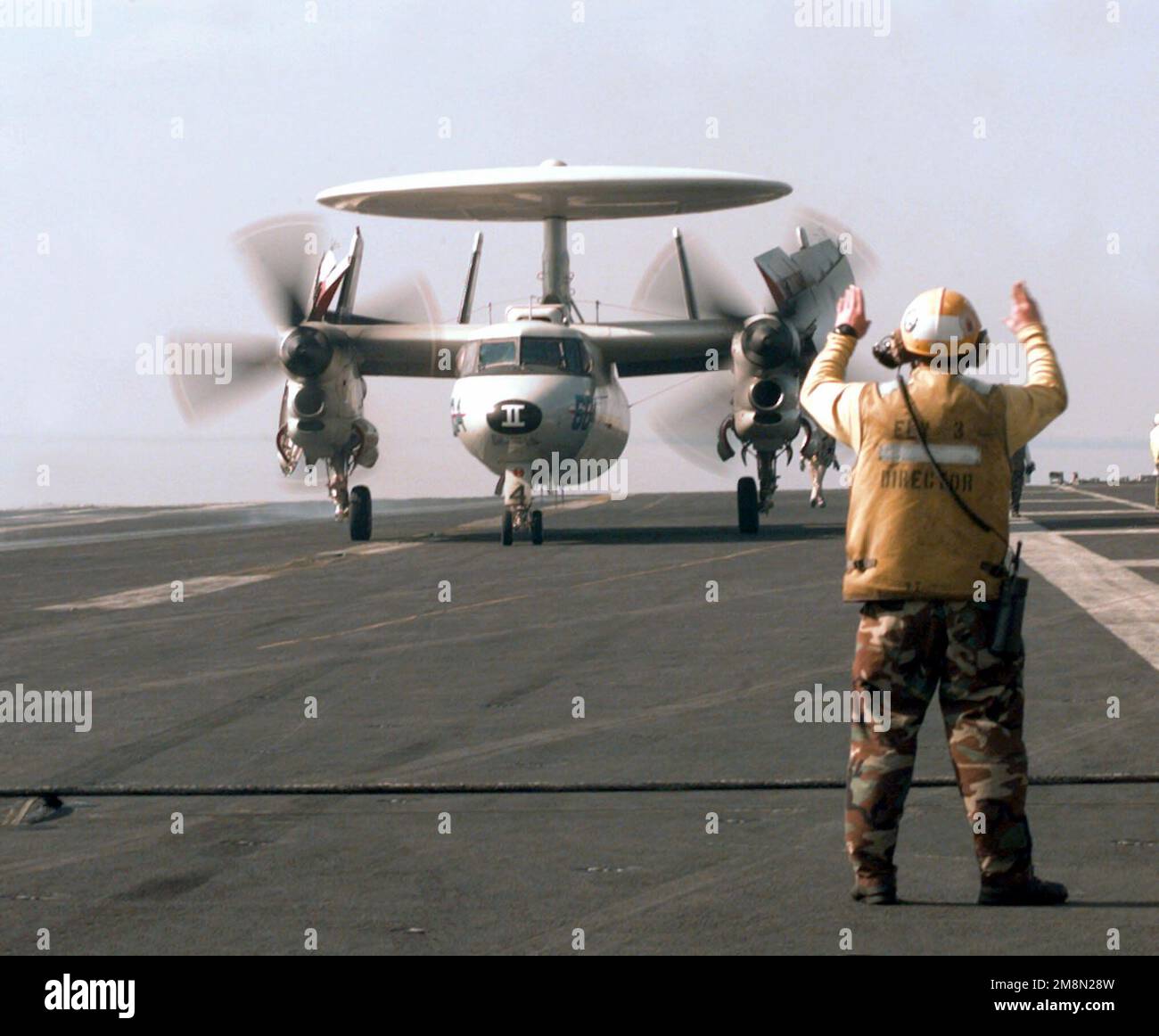 A sailor onboard the Nimitz Class Aircraft Carrier, USS John C. Stennis ...