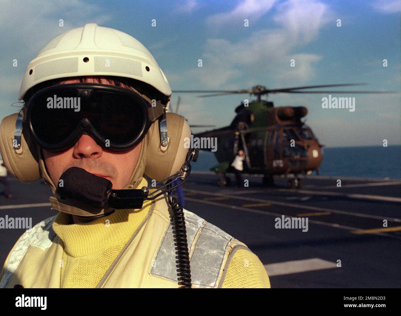 A Spanish Navy aircraft director stands by onboard the Spanish Prince ...