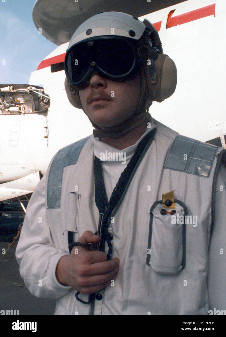 US Navy Boatswain's Mate Third Class Bradley D. Smith prepares to pipe aboard visitors (Not ...