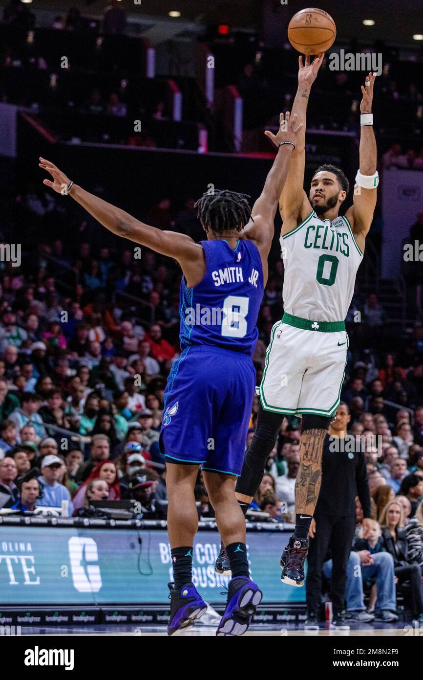 Charlotte Hornets guard Dennis Smith Jr. (8) guards a three point attempt by Boston Celtics ...