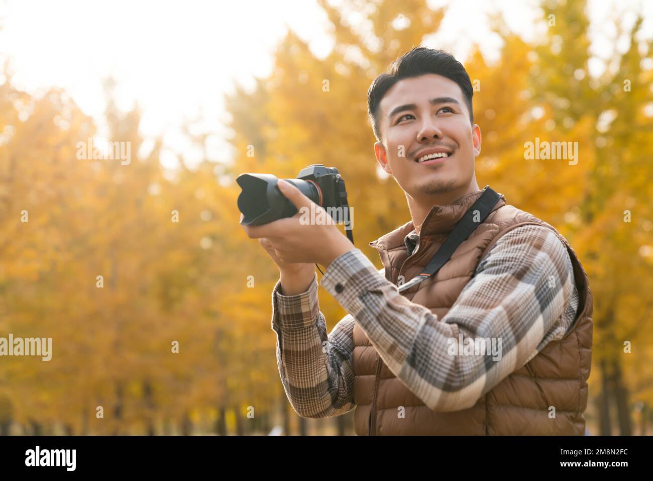 Young men here are taking photos Stock Photo - Alamy