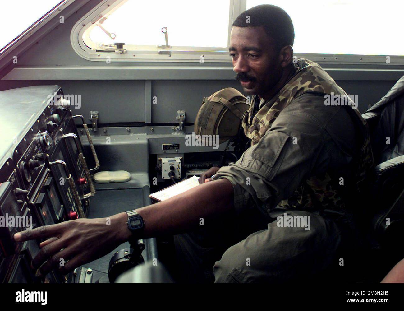 US Navy Engineman 1ST Class PETTY Officer John Scott checks the water's ...