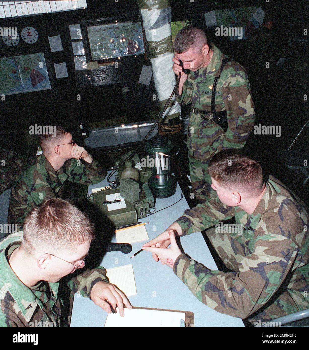The Marines in the Command Post located at Landing Zone Falcon are kept ...