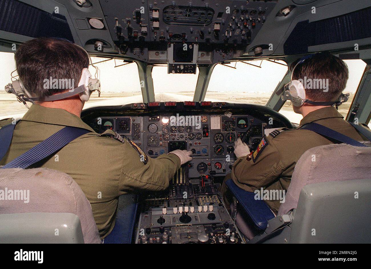 A view over the shoulders of a British Royal Air Force pilot (Left seat ...