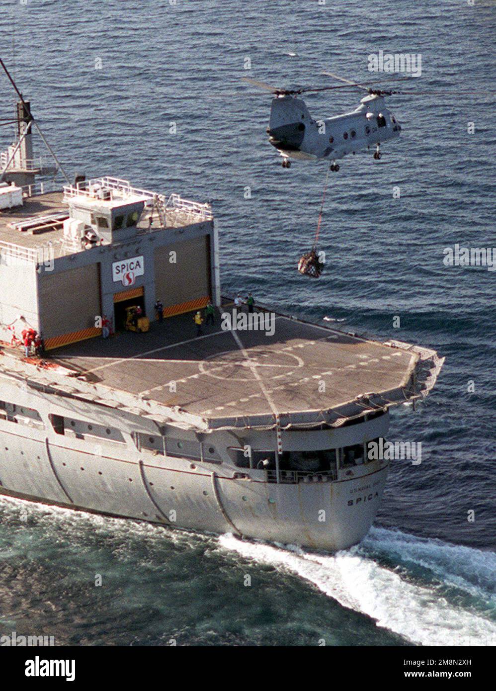 A US Marine CH-46 Sea hawk helicopter, of HC-5, lifts a sling load of ...