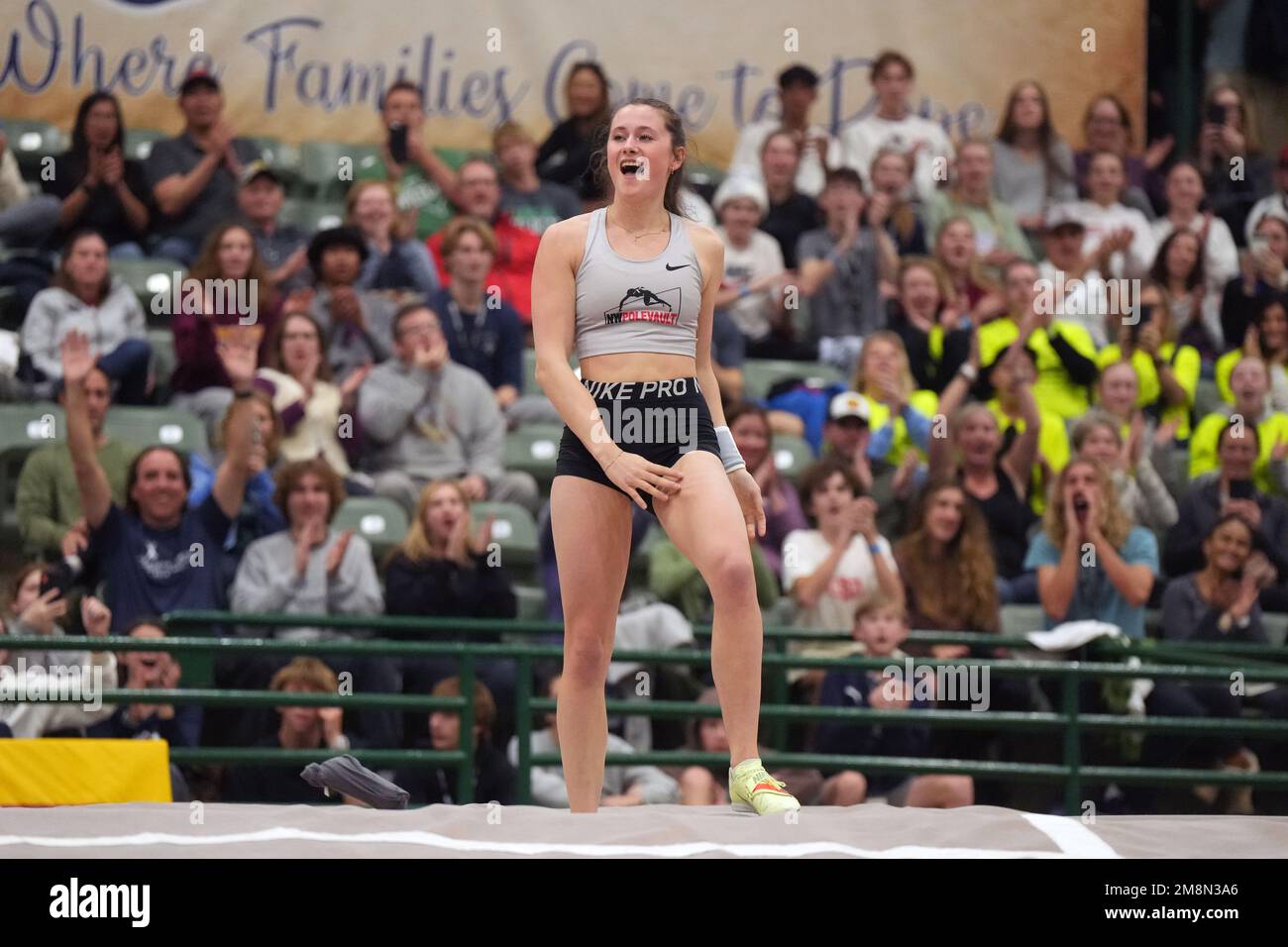 Amanda Moll celebrates after winning the elite women's division in an ...