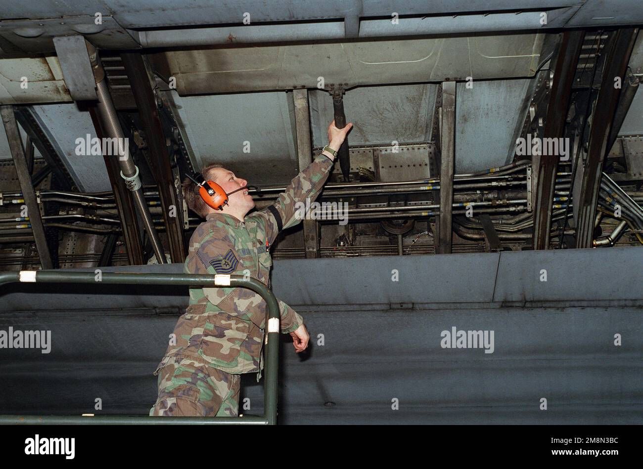 US Air Force Technical Sergeant David Weaver inspects flap mechanisms ...
