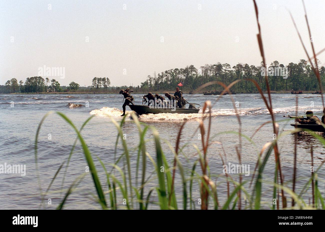 Marines from Charlie Company, 1/8, raid the New River shoreline with ...