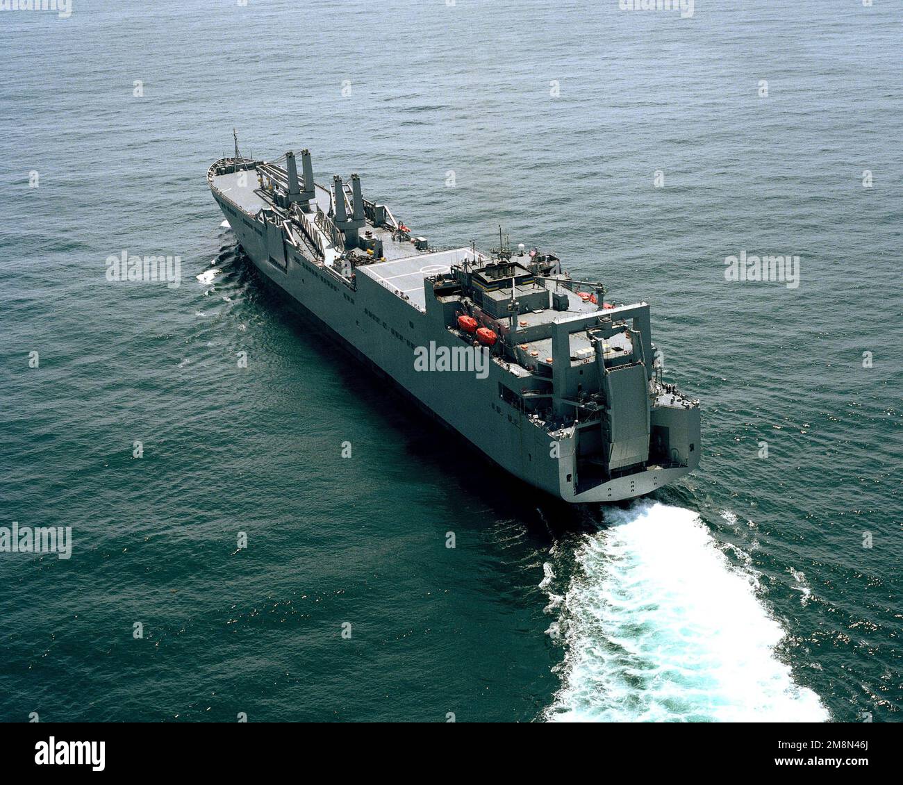 An aerial port quarter view of the Military Sealift Command (MSC) strategic heavy lift ship USNS ...