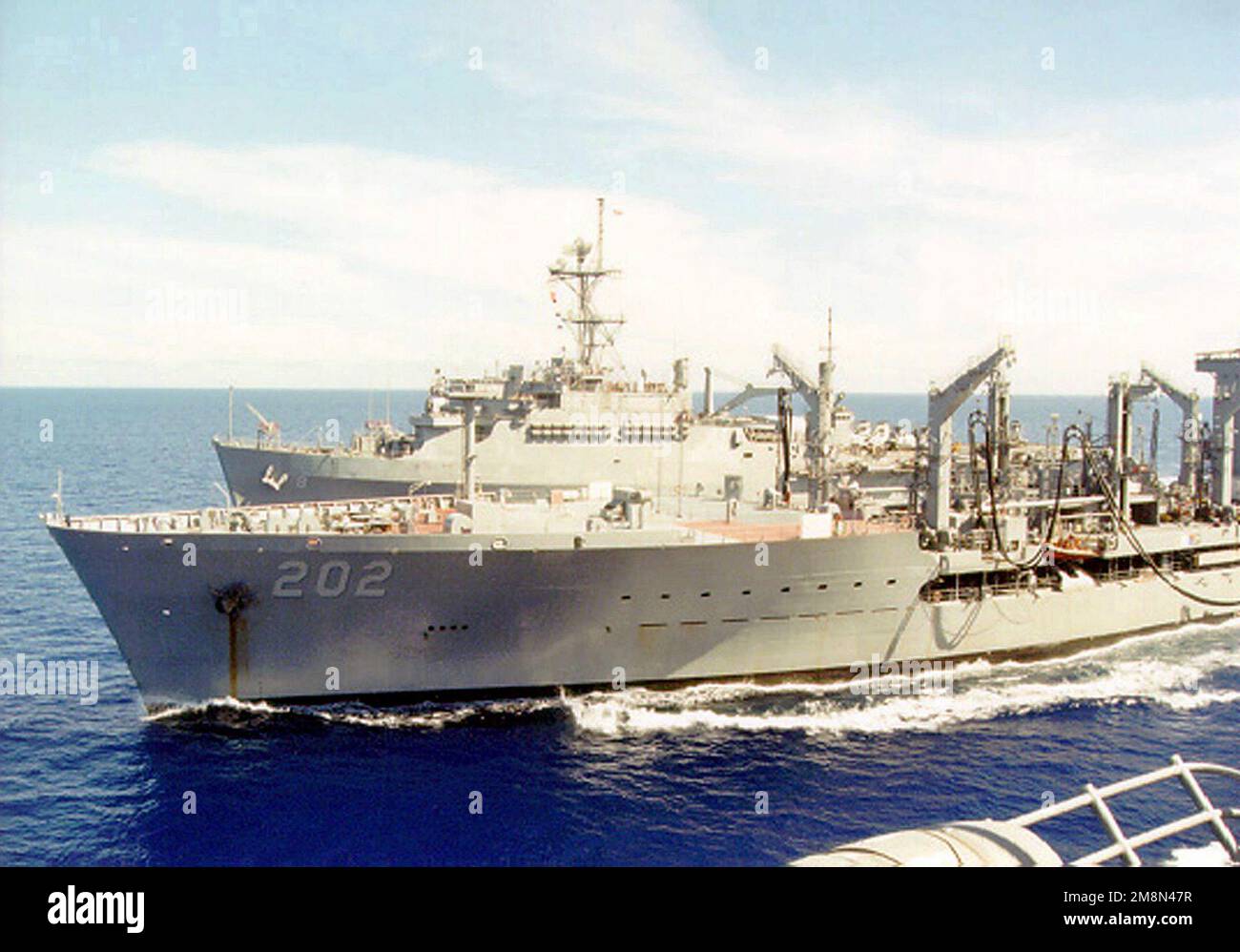 Military Sealift Command (MSC) oiler USNS YUKON (T-AO 202) (foreground ...