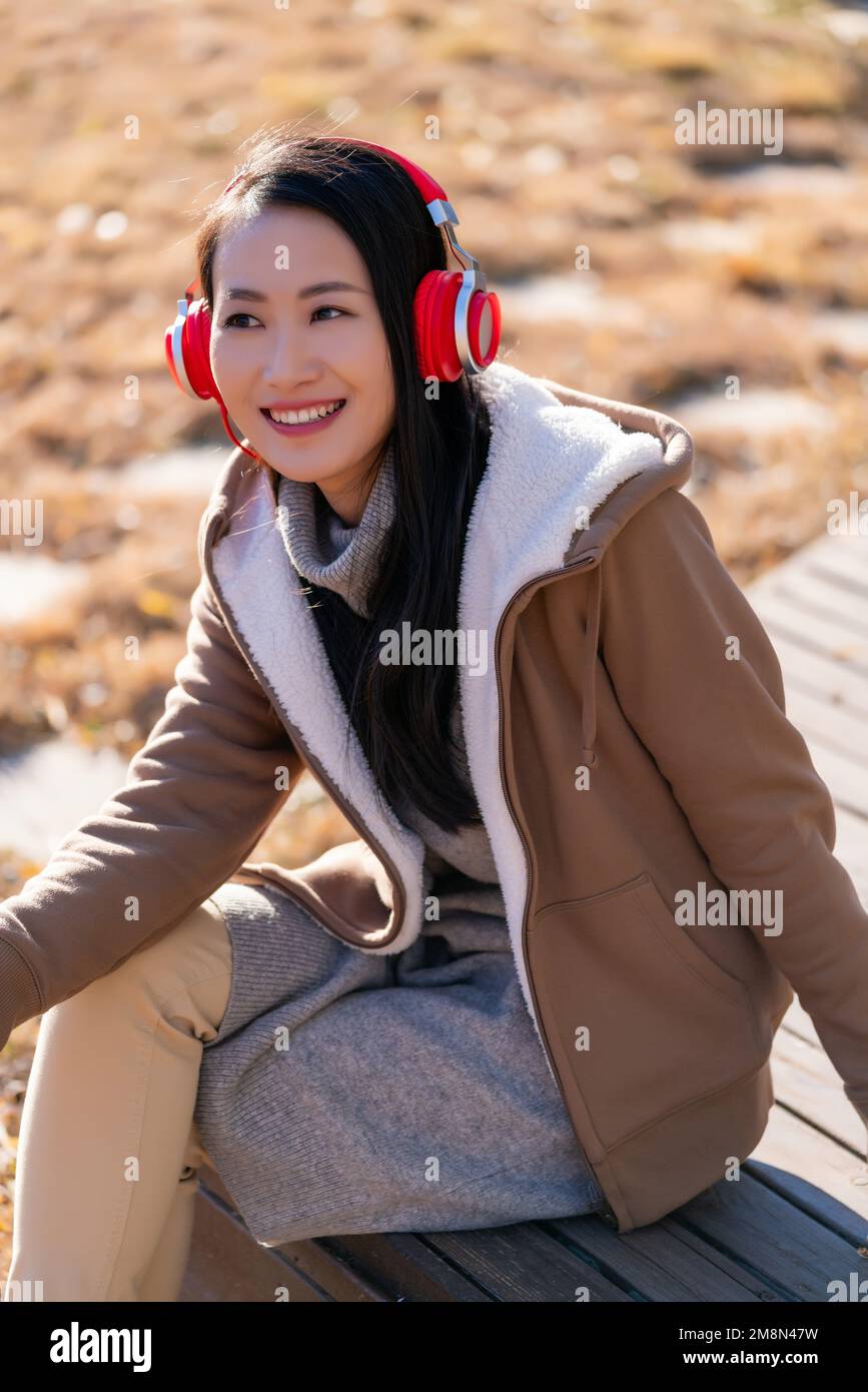 The young woman, listen to music Stock Photo - Alamy