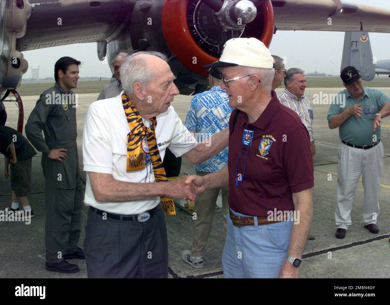 Brigadier General Robert Scott, (left), the oldest Flying Tiger, greets ...