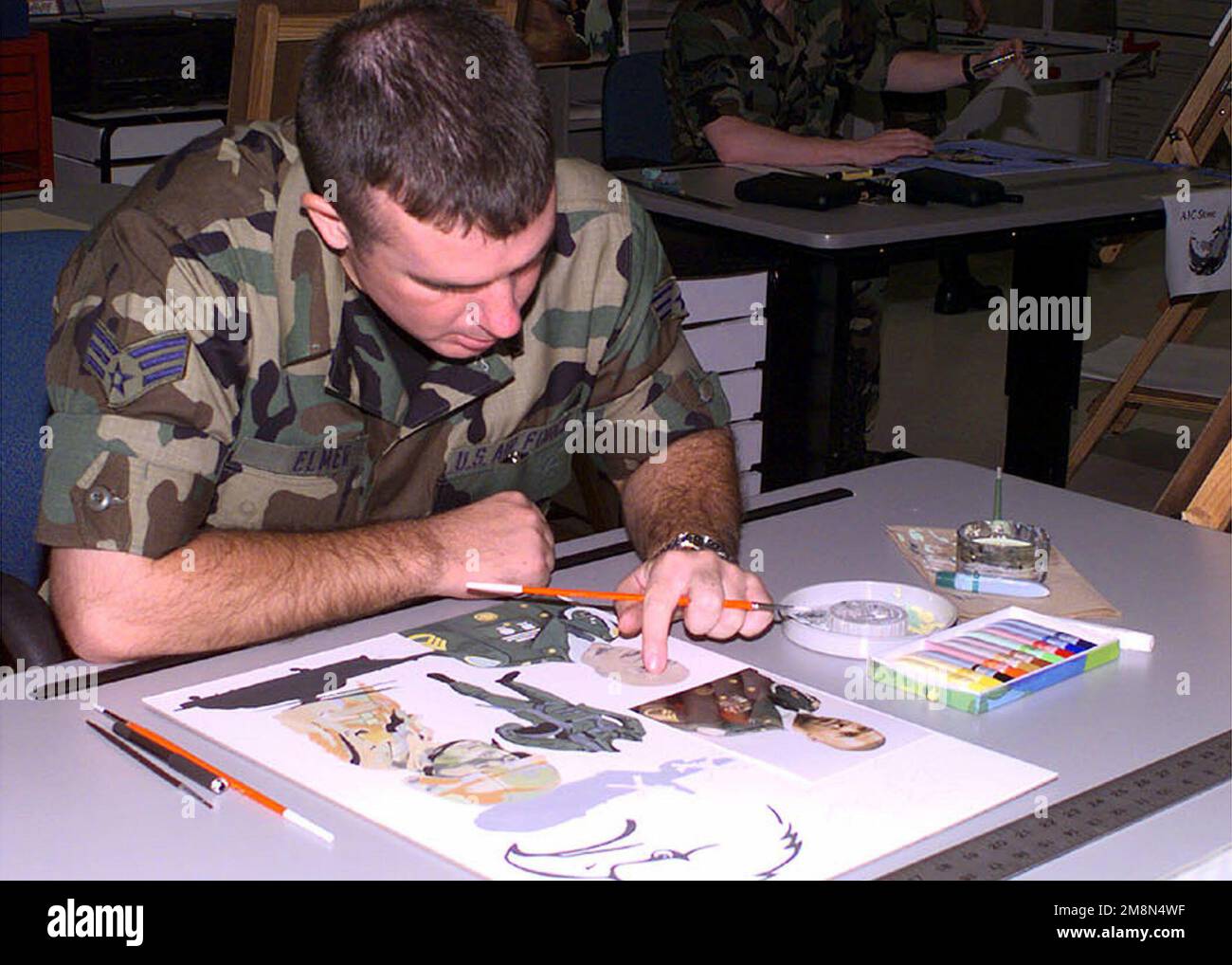 SRA Elmer works on his graphic artr project during the dedication and ...