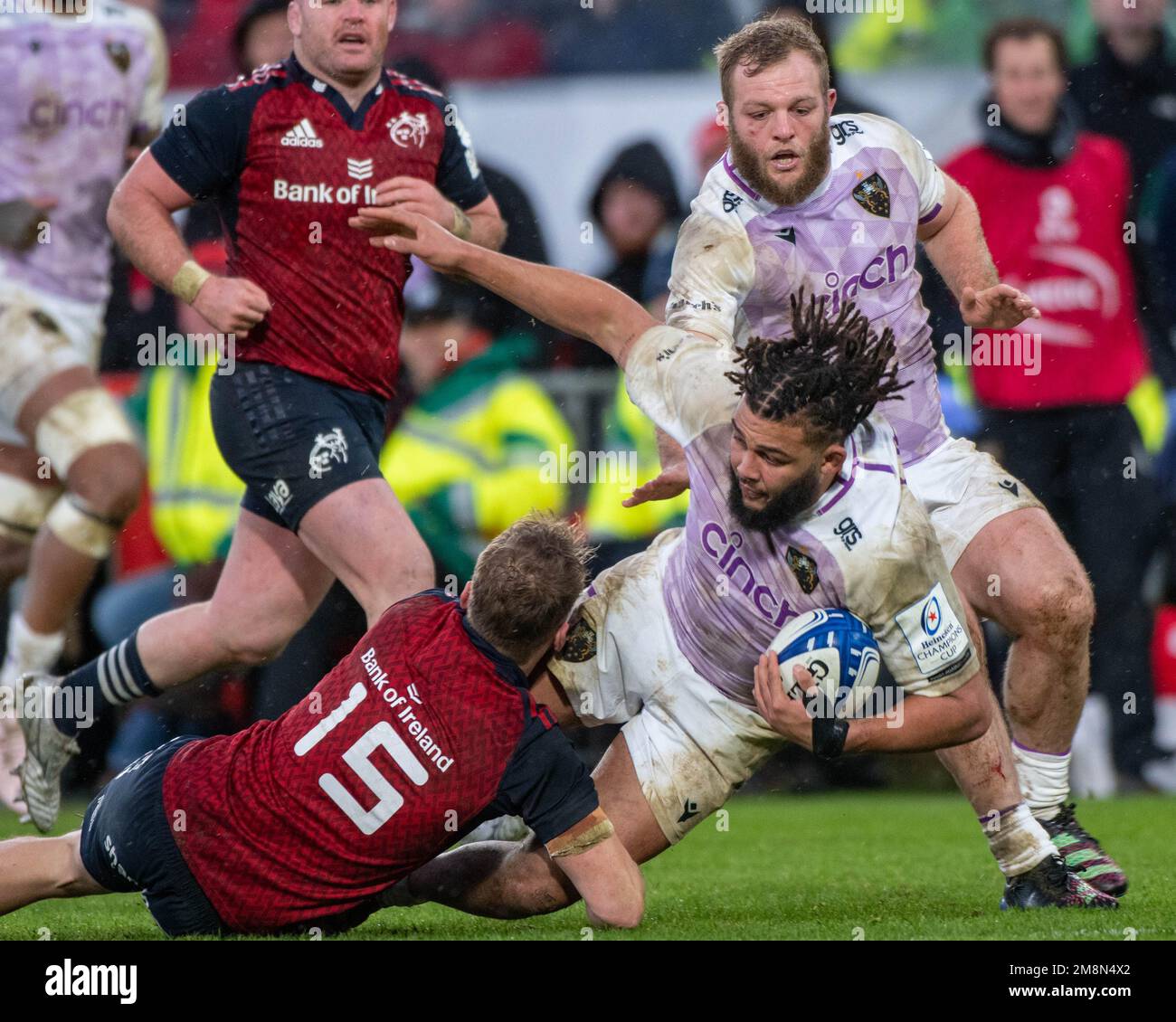 Lewis Ludlam (c) of Northampton tackled by Mike Haley of Munster during ...
