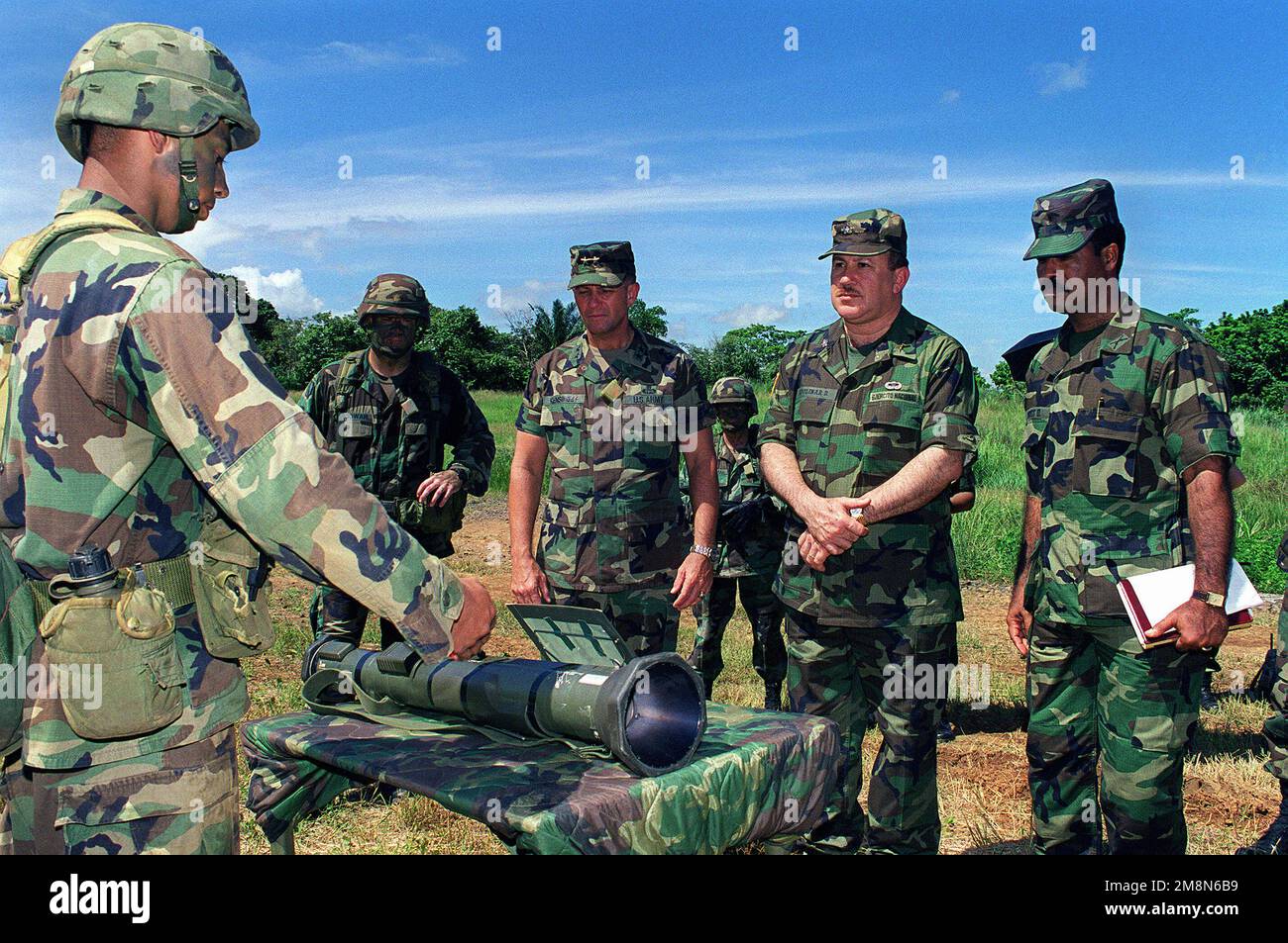 A member of 5-87th Infantry brief MGEN D. Apolinar (second from right ...