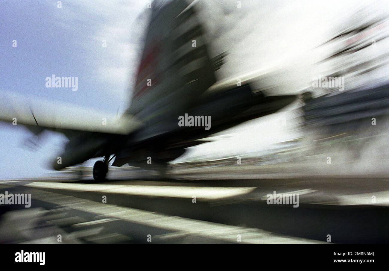 An F-18 aircraft catapults from the flight deck of the nuclear-powered ...