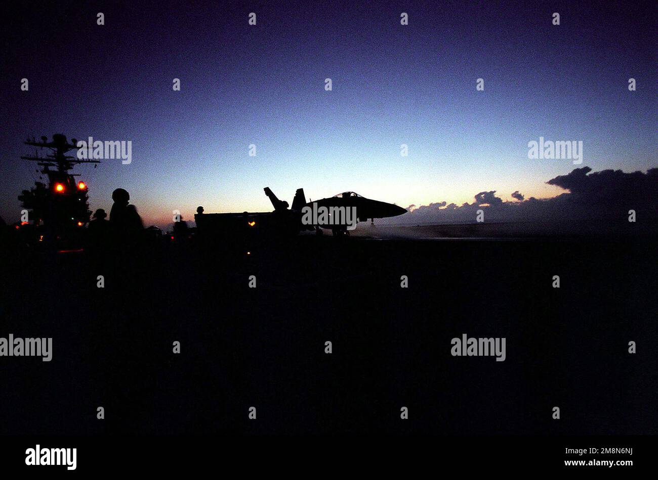 As the sun sets, flight operations on the nuclear-powered aircraft ...