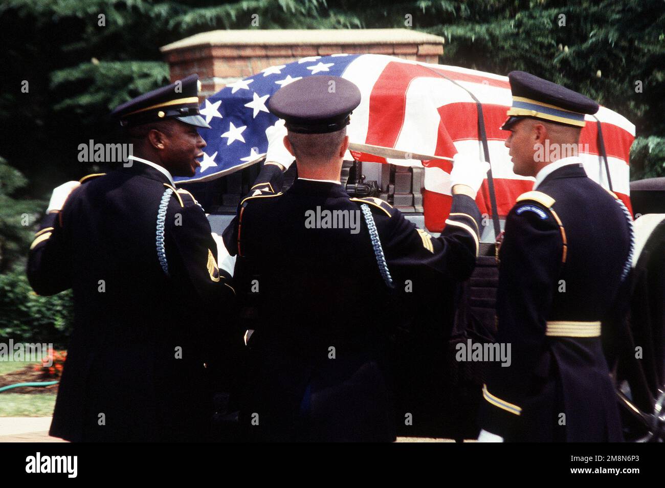 Members of Charlie Company, 3rd Infantry prepares a flag draped casket ...