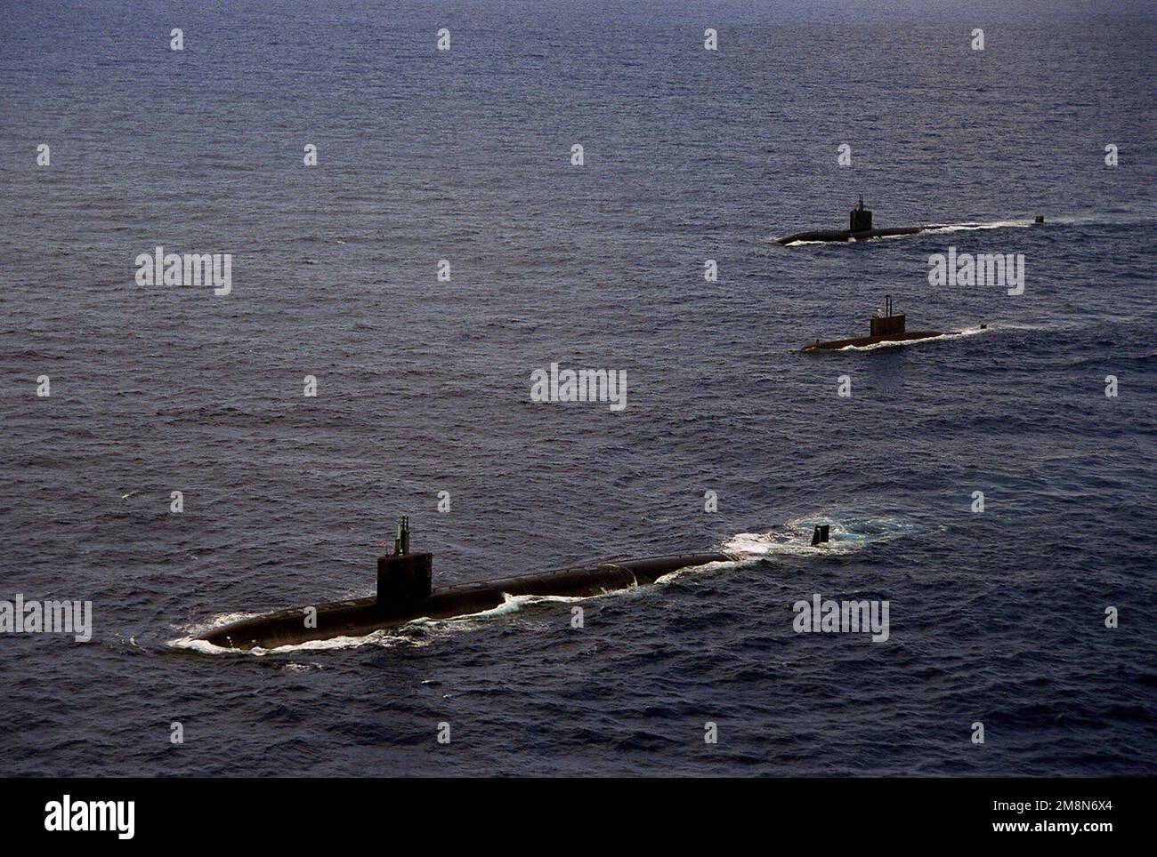 A trio of submarines patrol the Pacific Ocean near Hawaii during ...