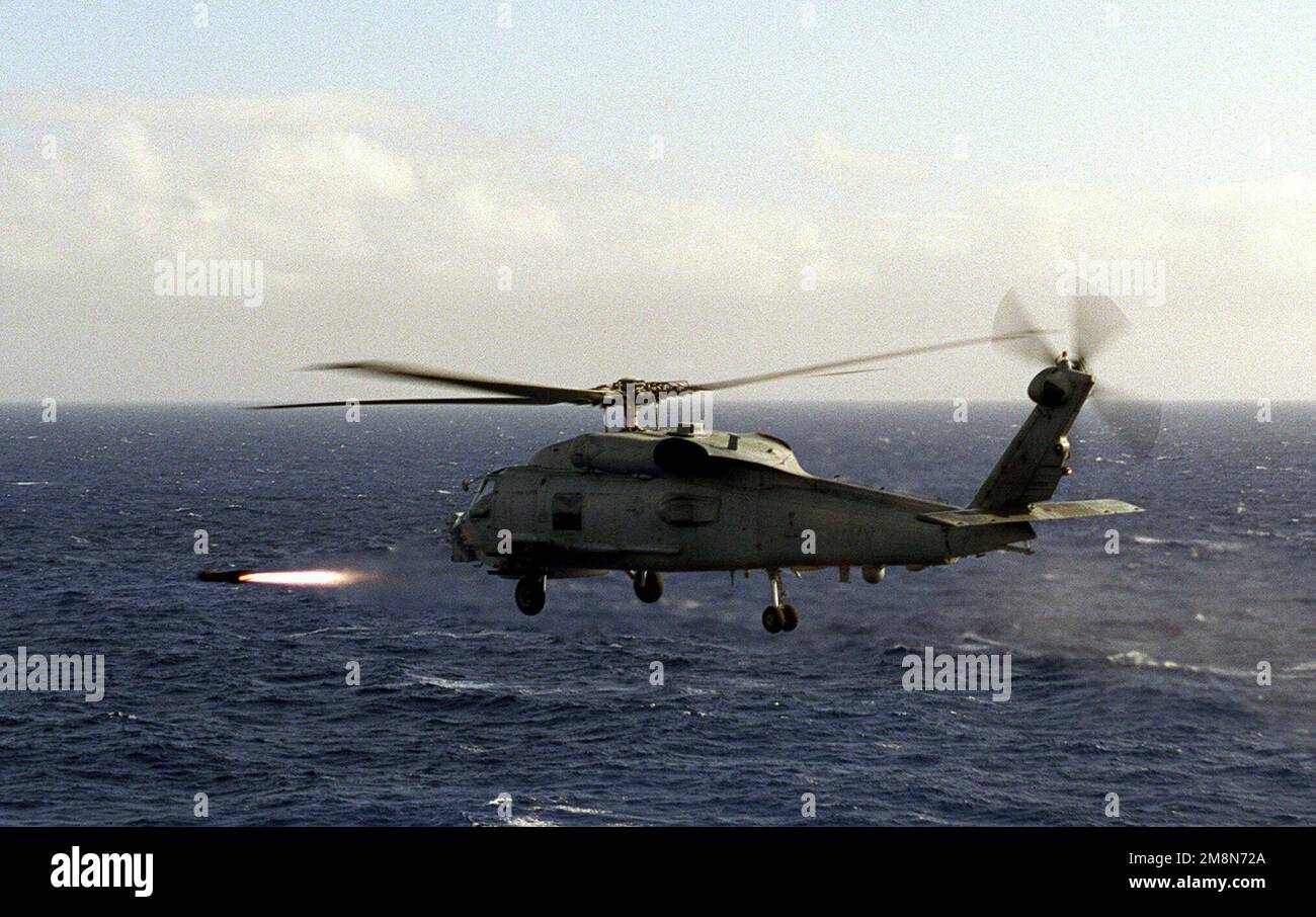 An AGM 114 Hellfire missile is launched from an SH-60B Seahawk ...