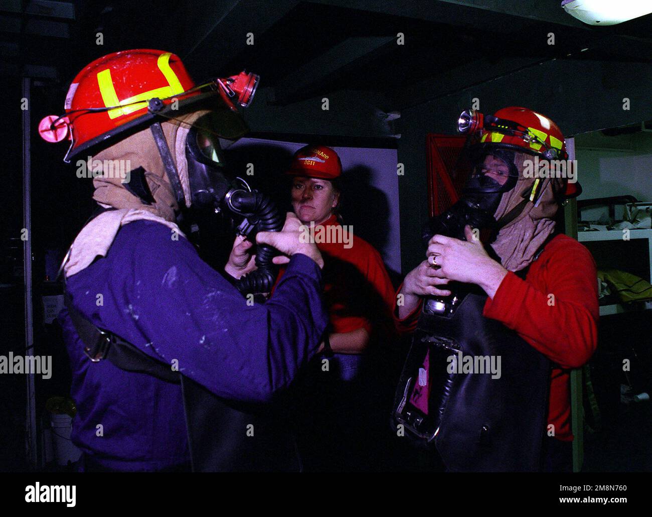 Fire party members aboard the auxiliary command ship USS CORONADO (AGF ...