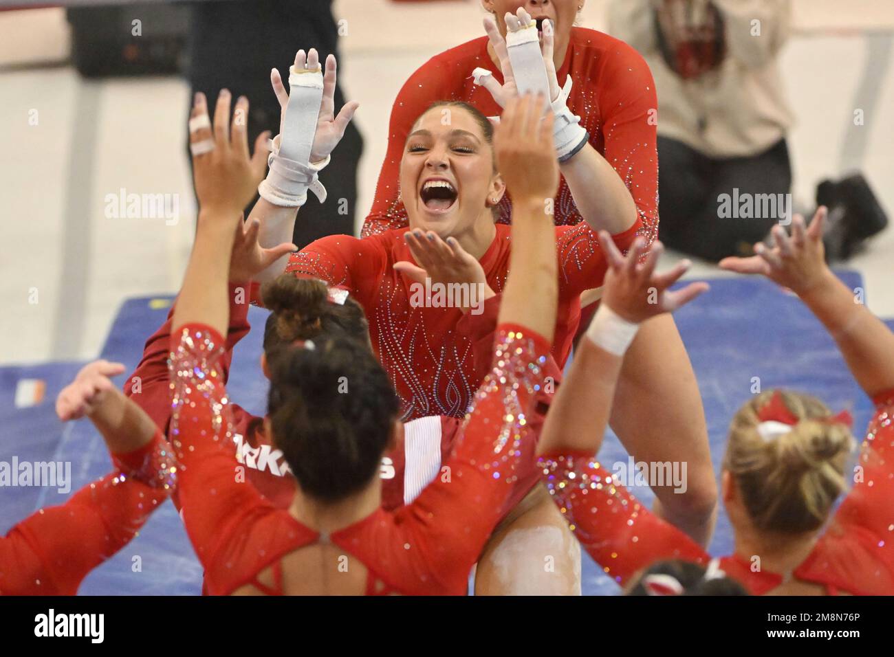 Arkansas gymnast Jensen Scalzo reacts after competing on the bars ...