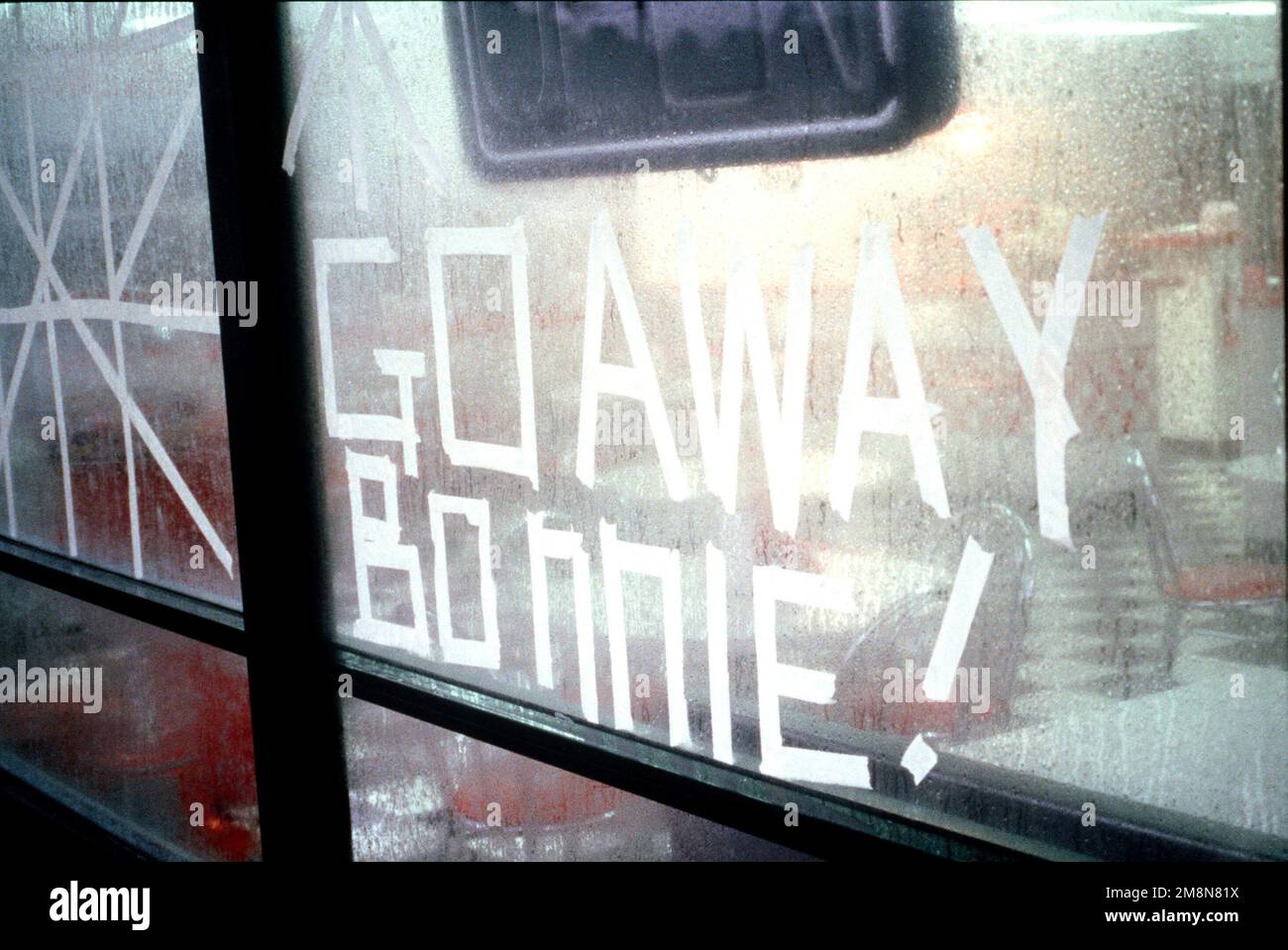Storefront windows with taped messages that read "GO AWAY BONNIE" are ...