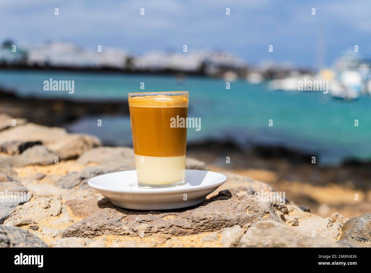 Delicious barraquito coffee with liquor and condensed milk, typical for ...