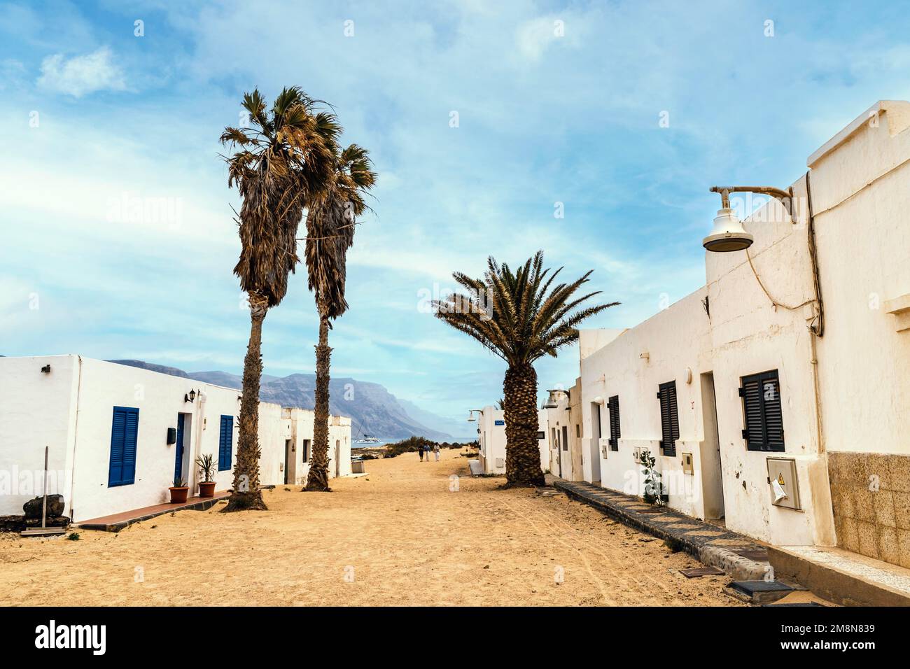 Sandy streets and white houses in Caleta del Sebo, Lanzarote in the ...