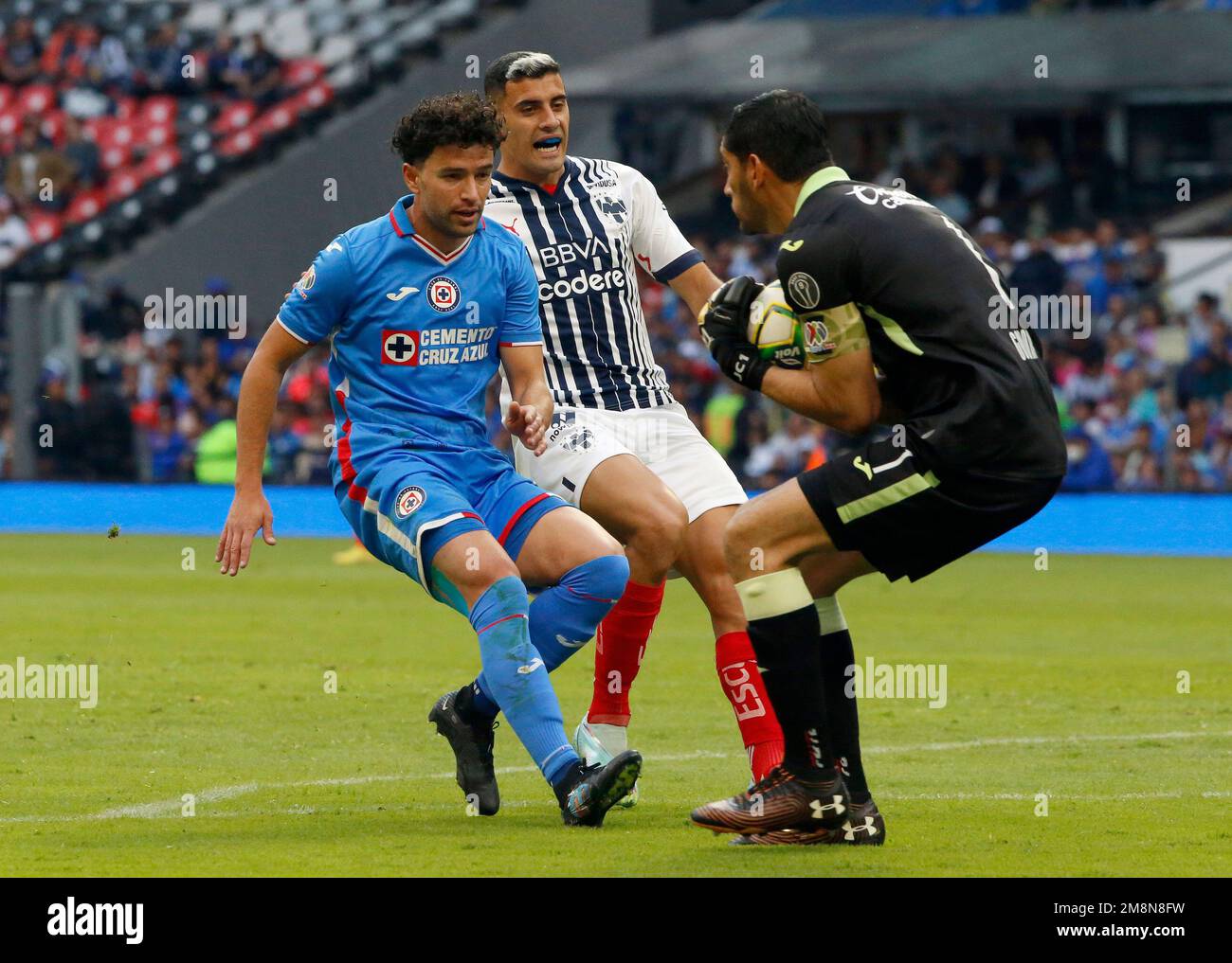 Cruz Azul's goalkeeper Jesus Corona grabs the ball as Monterrey's ...