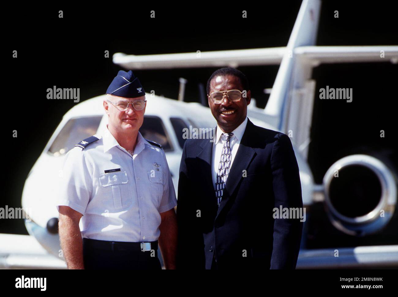 Straight on medium shot of USAF Colonel Dennis Adams (Left), Commander ...