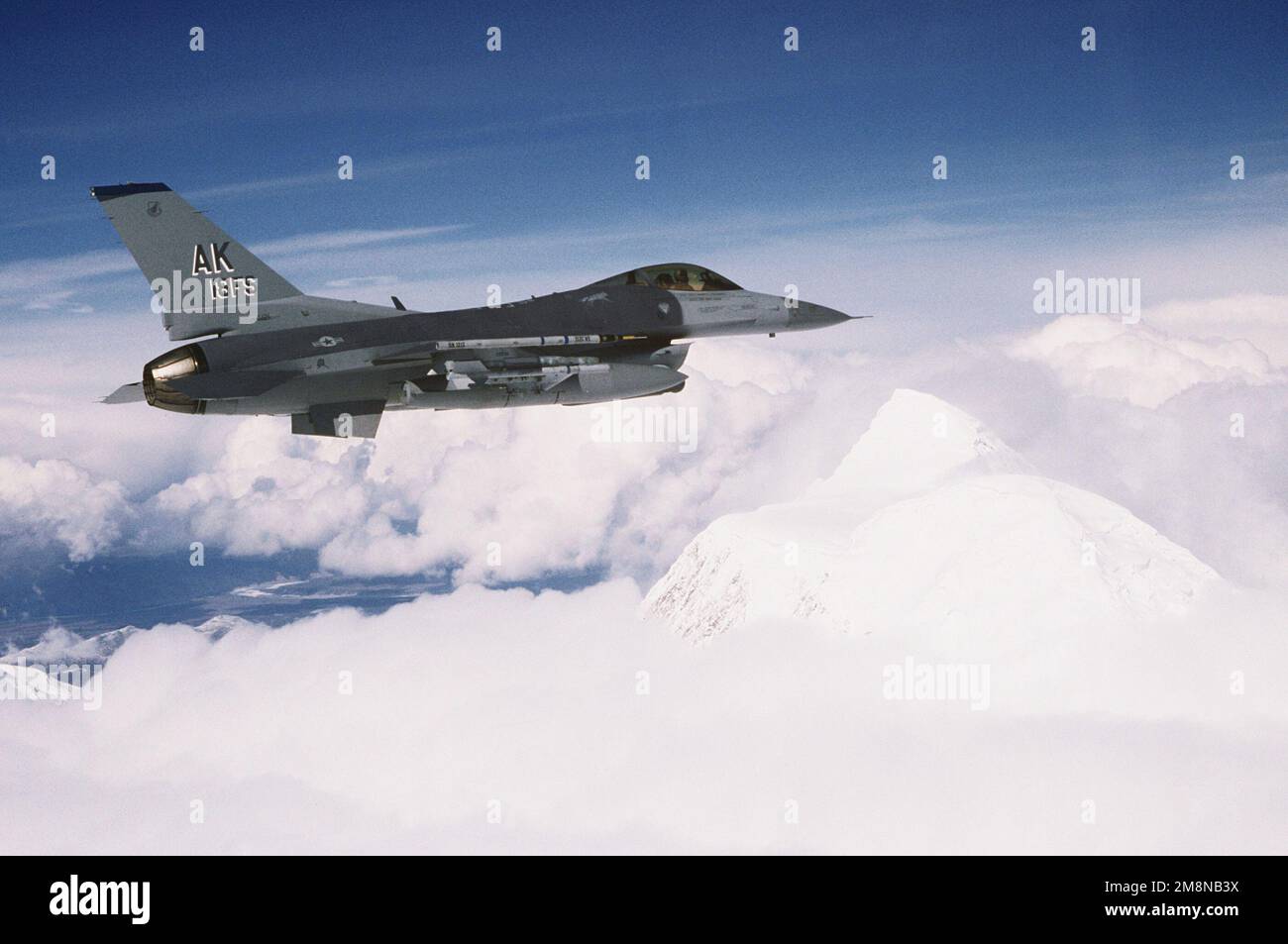 Right side medium shot, aerial view, of a USAF F-16 from the 354th ...